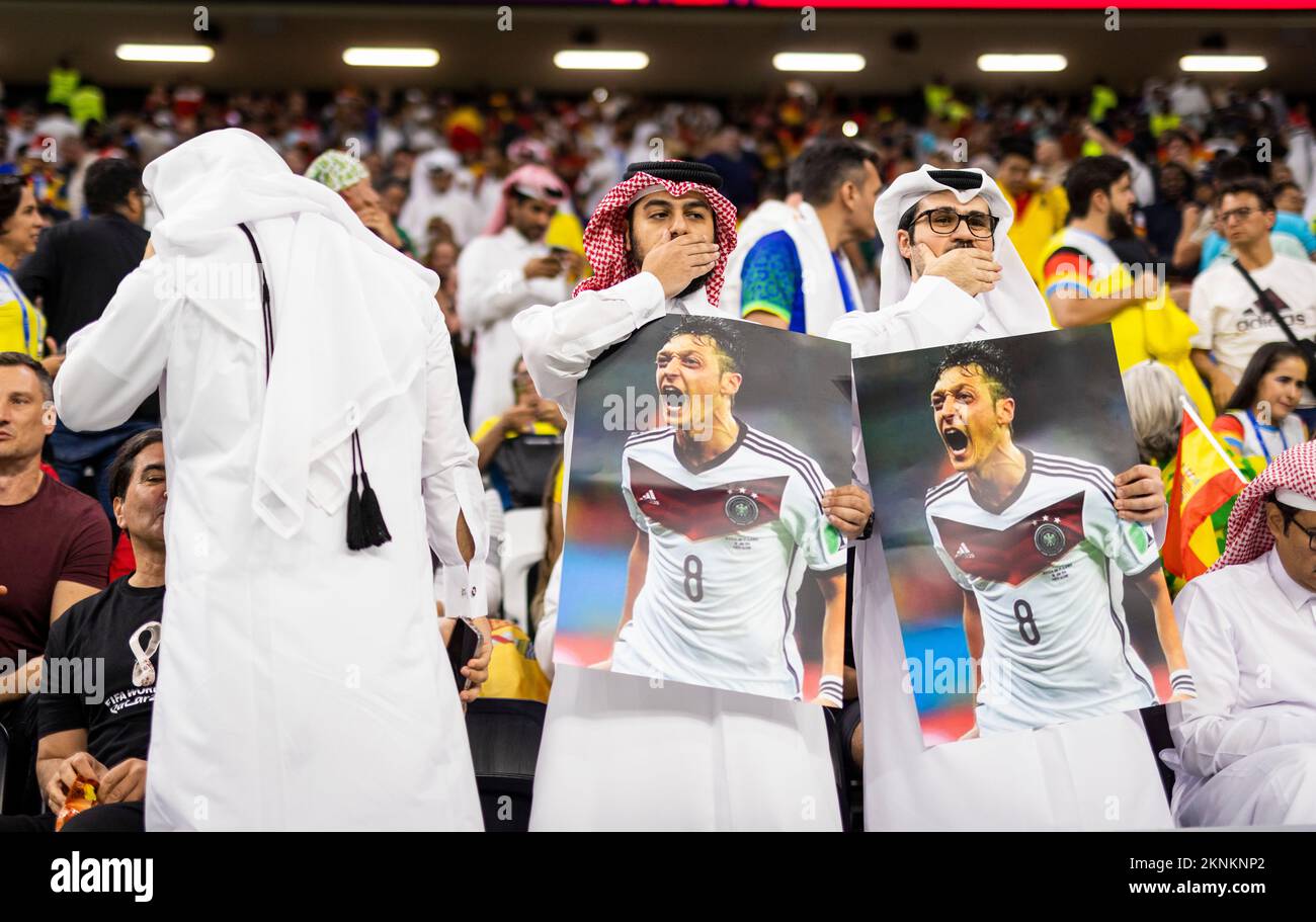 Doha, Qatar. 27th Nov, 2022. Fans mock German protest with poster of ...