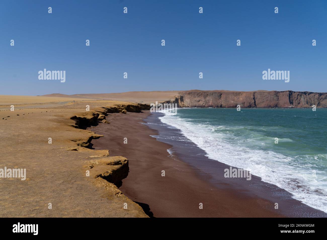 A beautiful shot of a red sand beach in the Paracas National Park, Peru ...