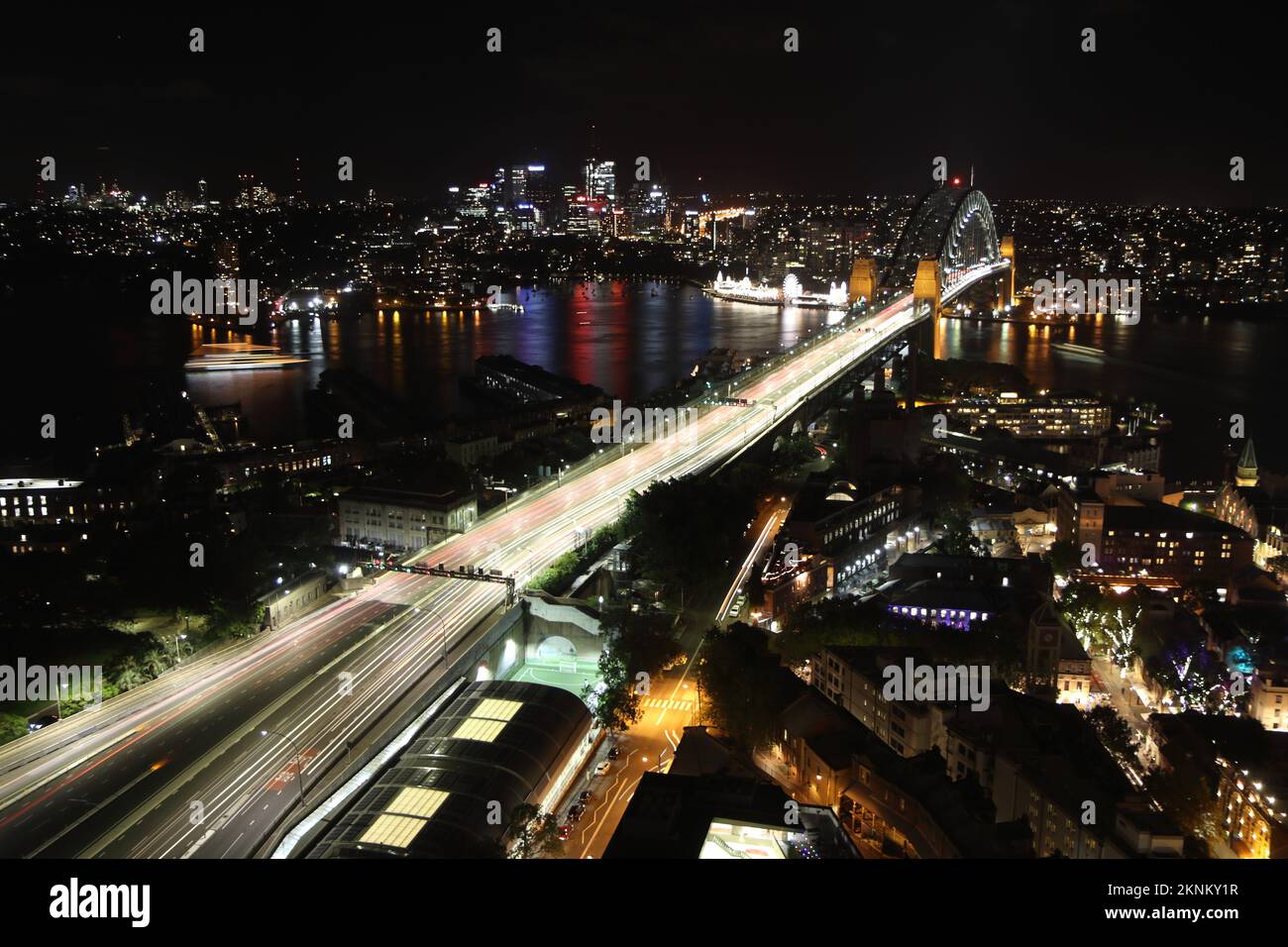 A bird's eye view of the Sydney Harbour Bridge at night, long exposure ...