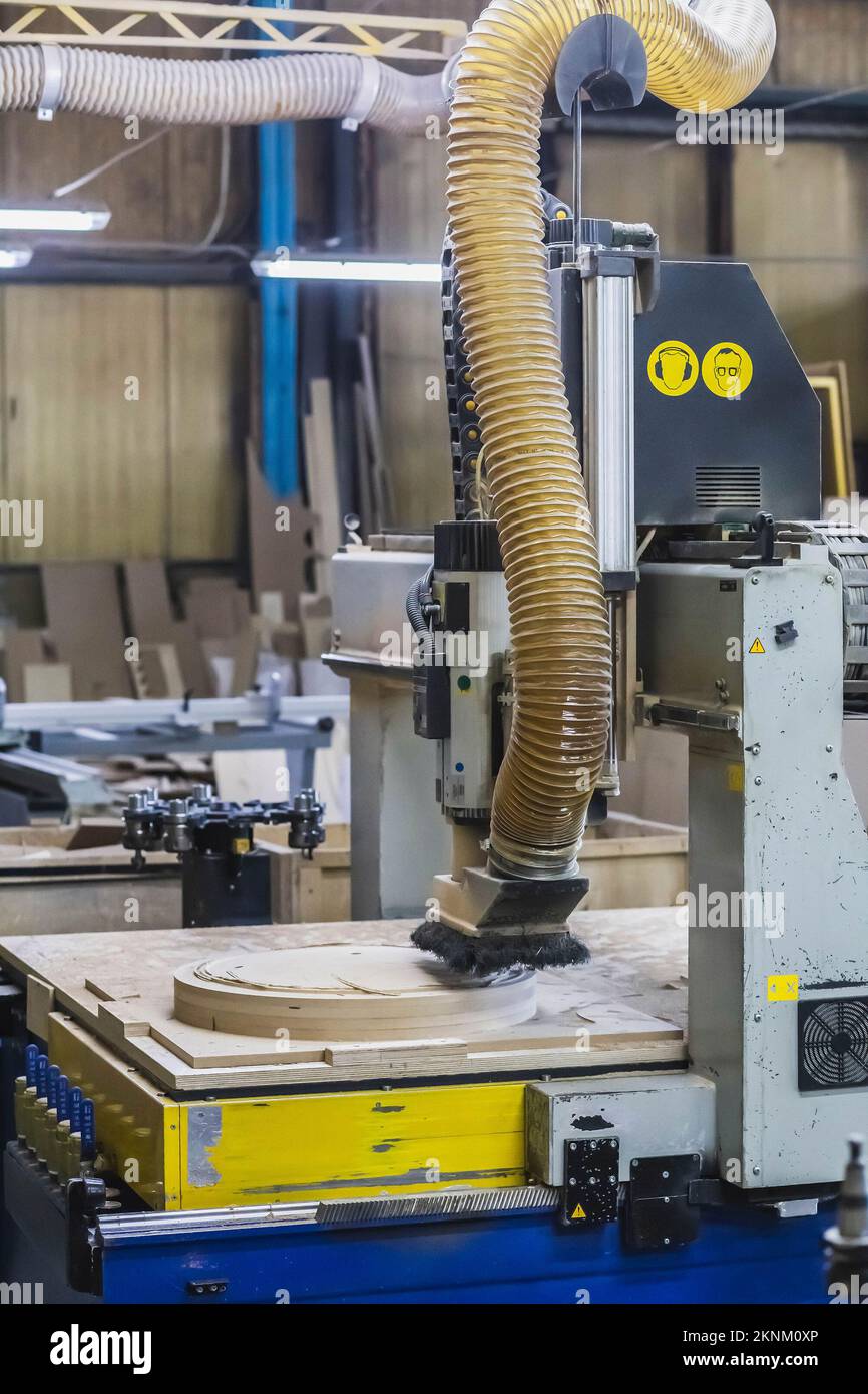 CNC machine cuts a round piece at the factory Stock Photo - Alamy