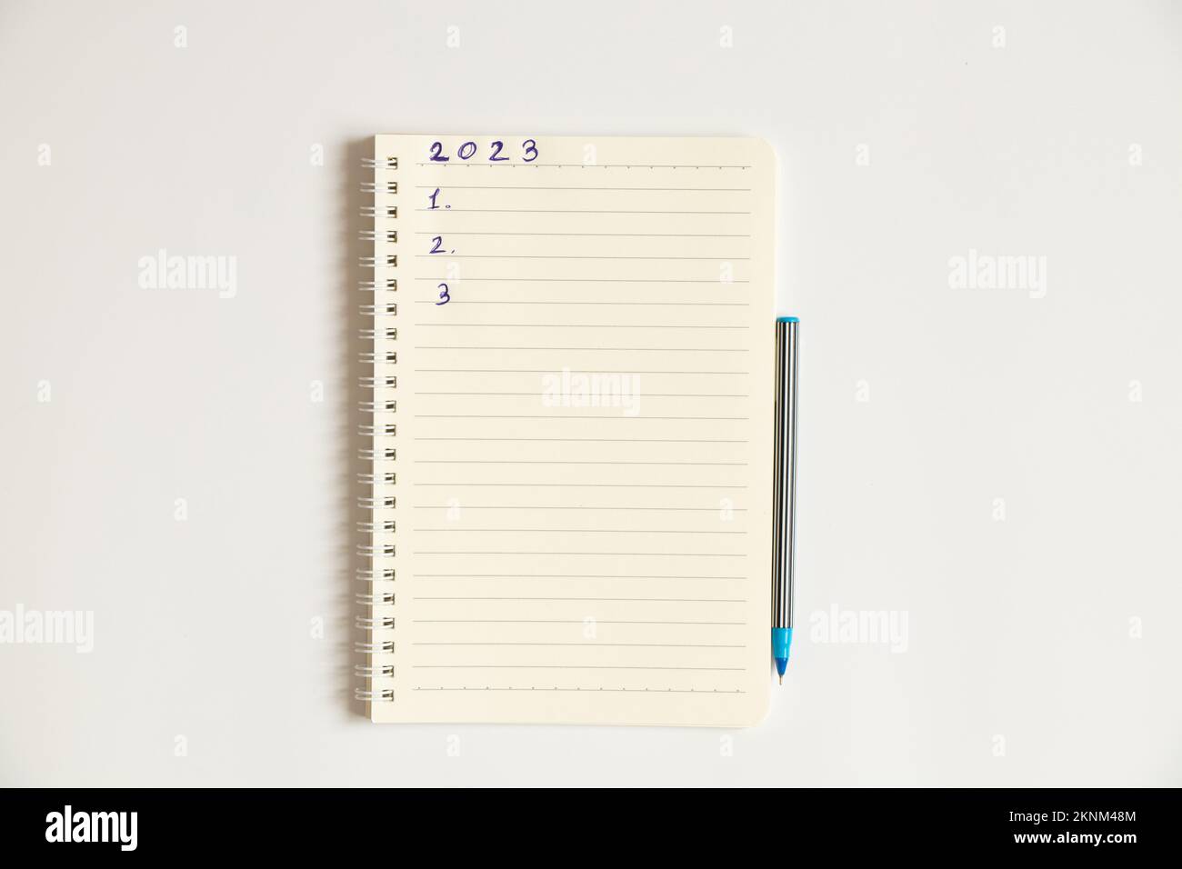White notepad with the text 2023 and the numbering 123 on a white ...