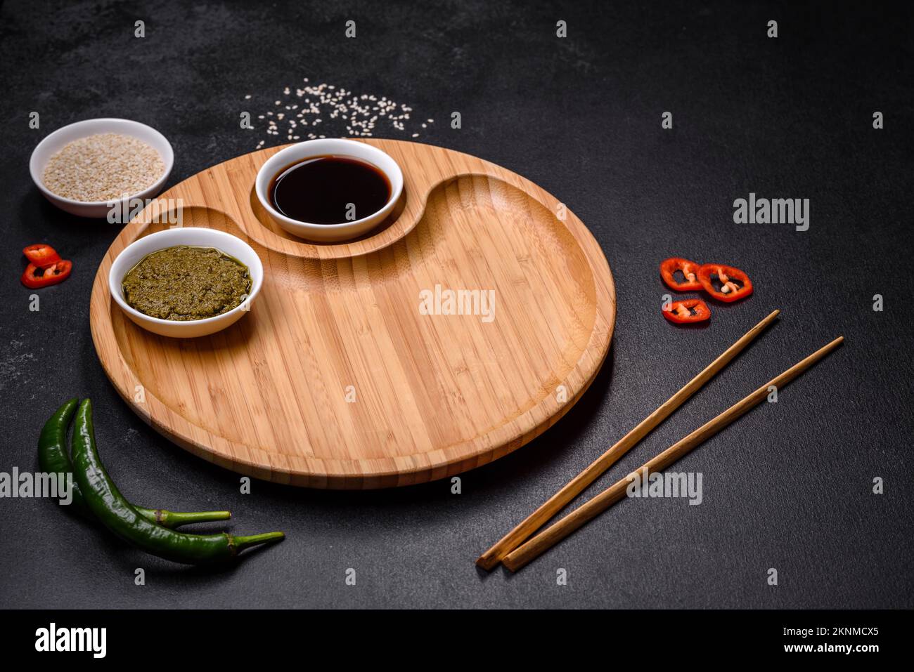 Empty plate with wooden sticks for Asian food on a dark concrete ...