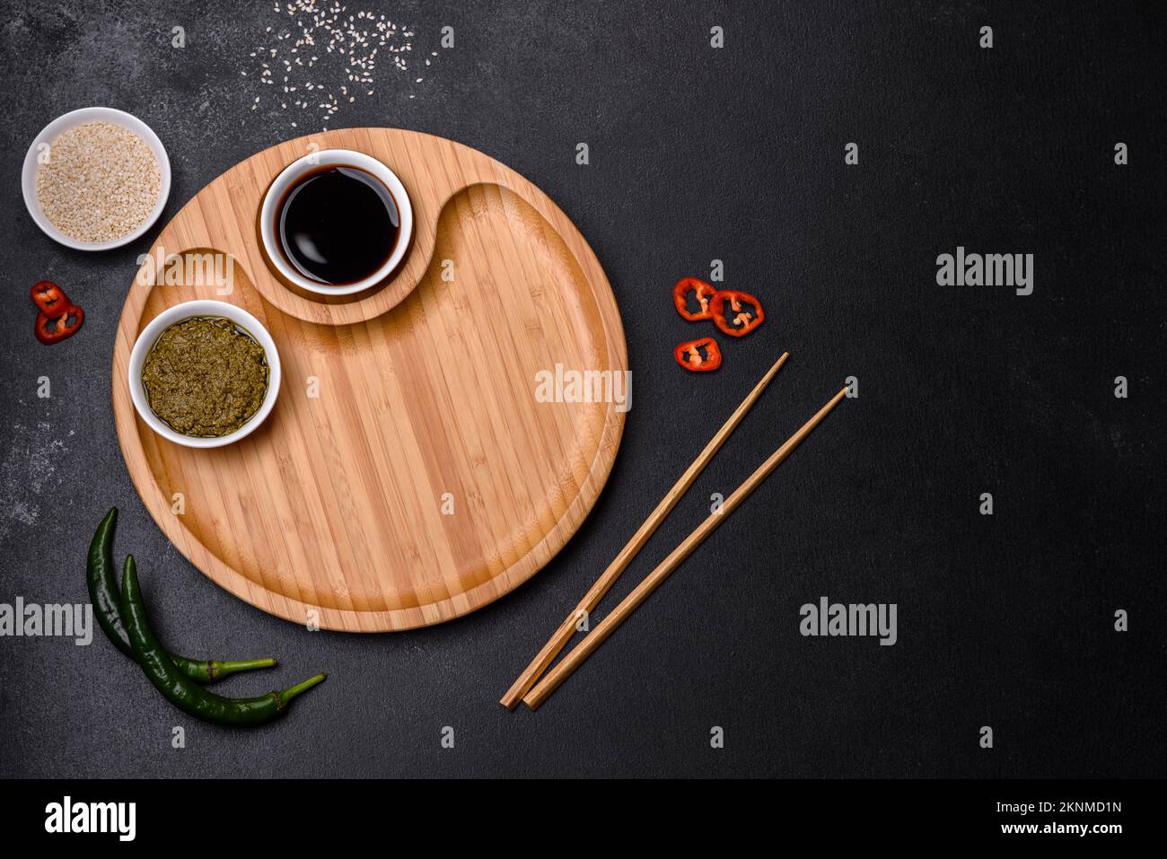 Empty plate with wooden sticks for Asian food on a dark concrete ...