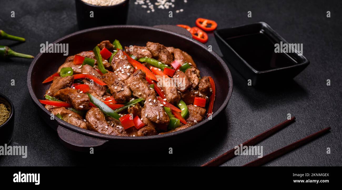 Delicious Asian teriyaki meat with red and green bell peppers and ...