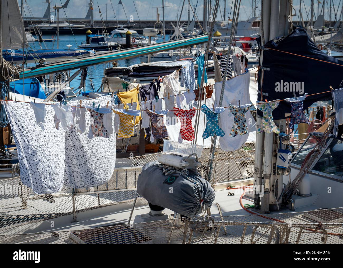 Washed clothes to dry on clothesline on a sailboat Stock Photo - Alamy