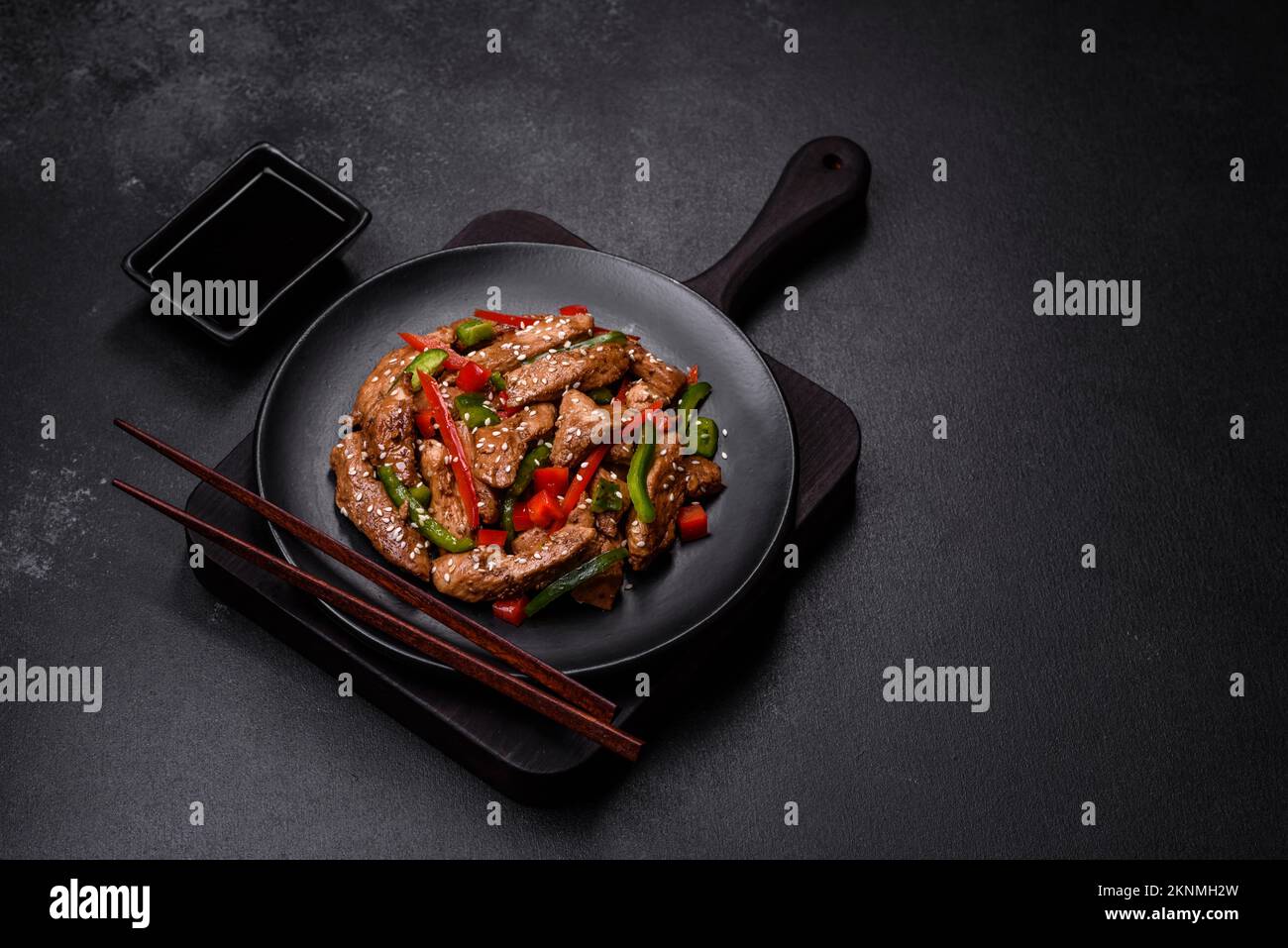 Delicious Asian teriyaki meat with red and green bell peppers and ...