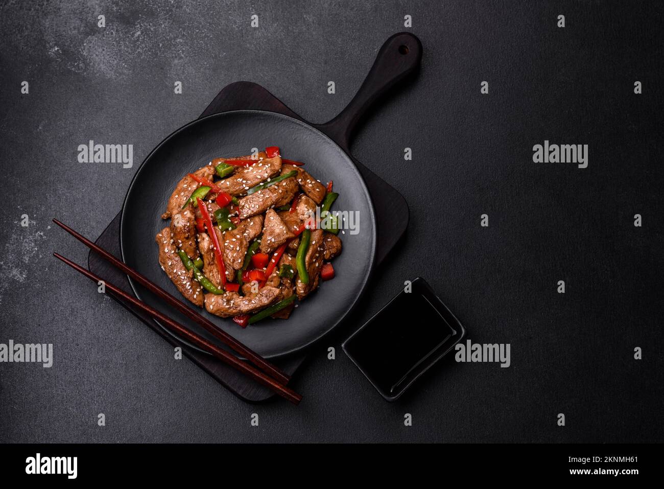 Delicious Asian teriyaki meat with red and green bell peppers and ...