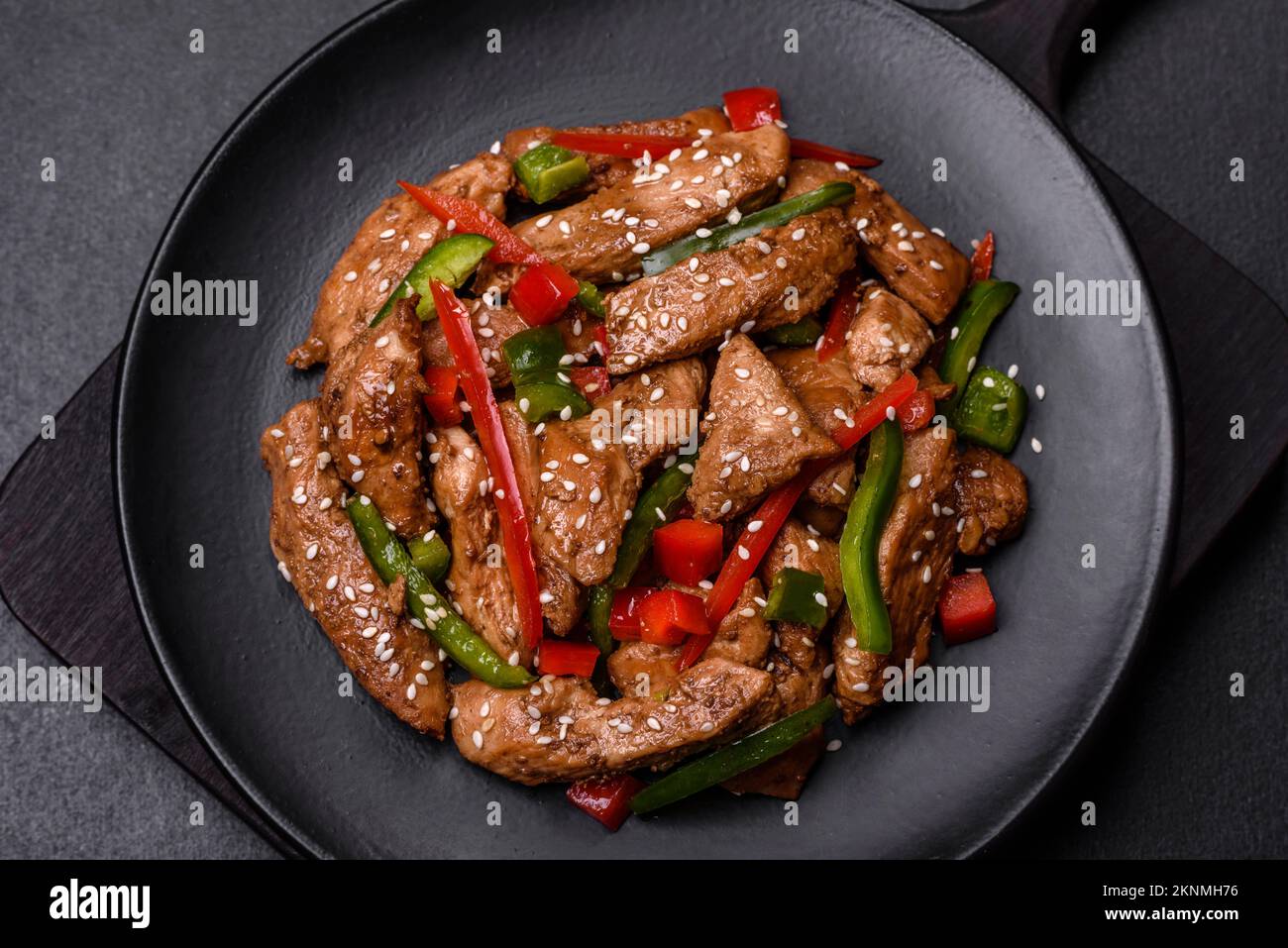 Delicious Asian teriyaki meat with red and green bell peppers and ...