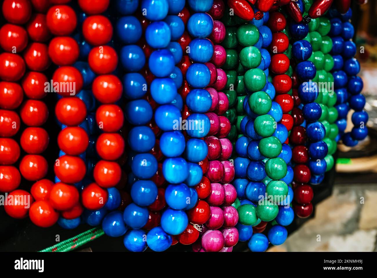 Wooden red beads on the market Stock Photo - Alamy