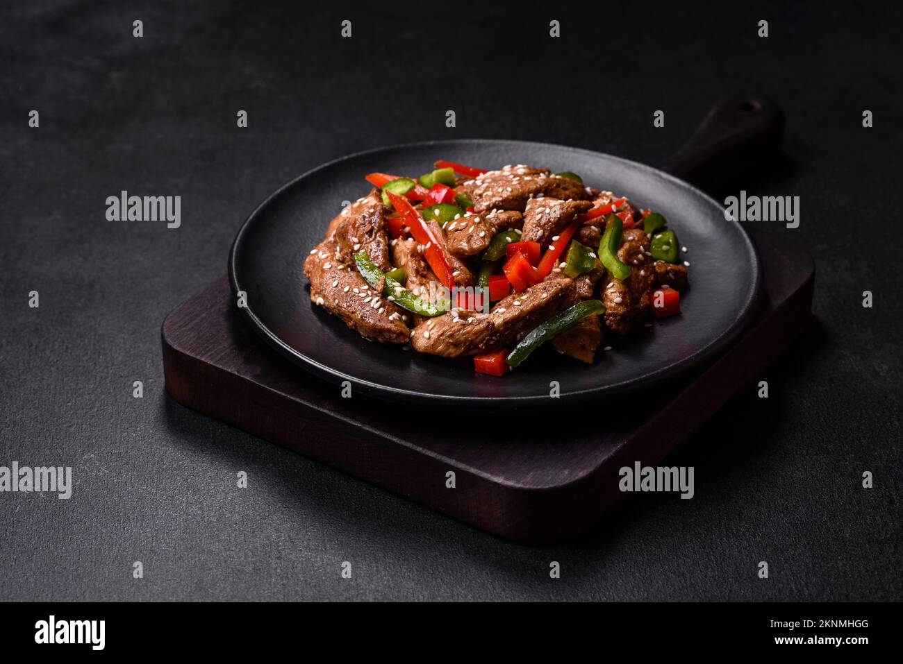 Delicious Asian teriyaki meat with red and green bell peppers and ...