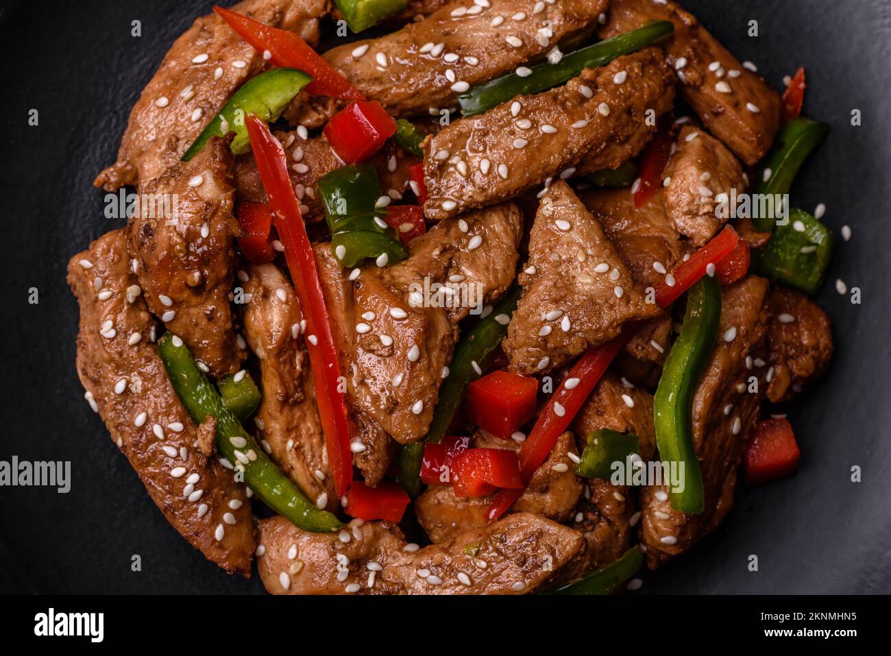 Delicious Asian teriyaki meat with red and green bell peppers and ...