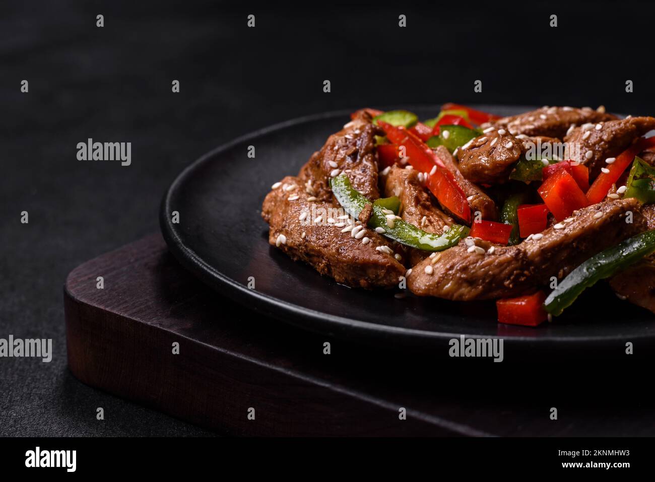 Delicious Asian teriyaki meat with red and green bell peppers and ...