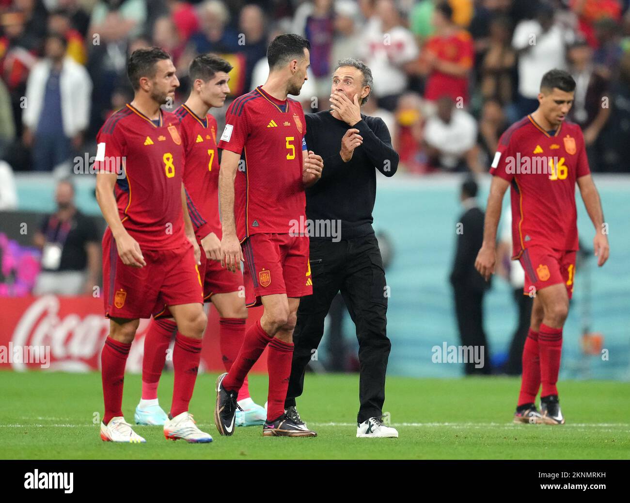 Spain manager Luis Enrique (right) talks to Sergio Busquets following ...