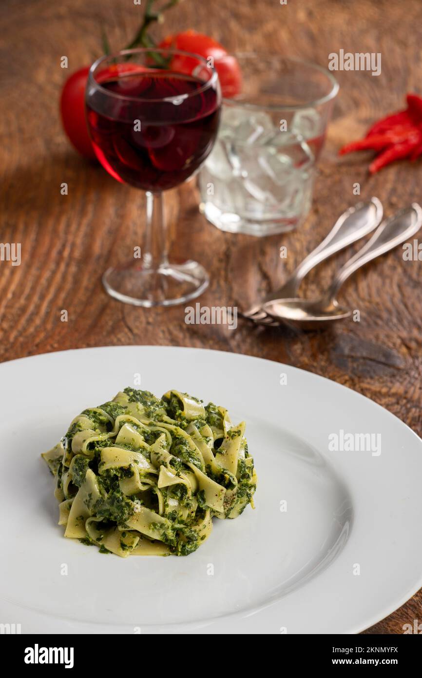 italian tagliatelli pasta with spinach sauce Stock Photo - Alamy