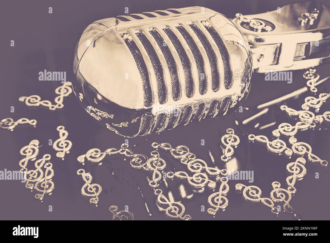 Classy still life art on a musical mic staged with clefs of treble ...