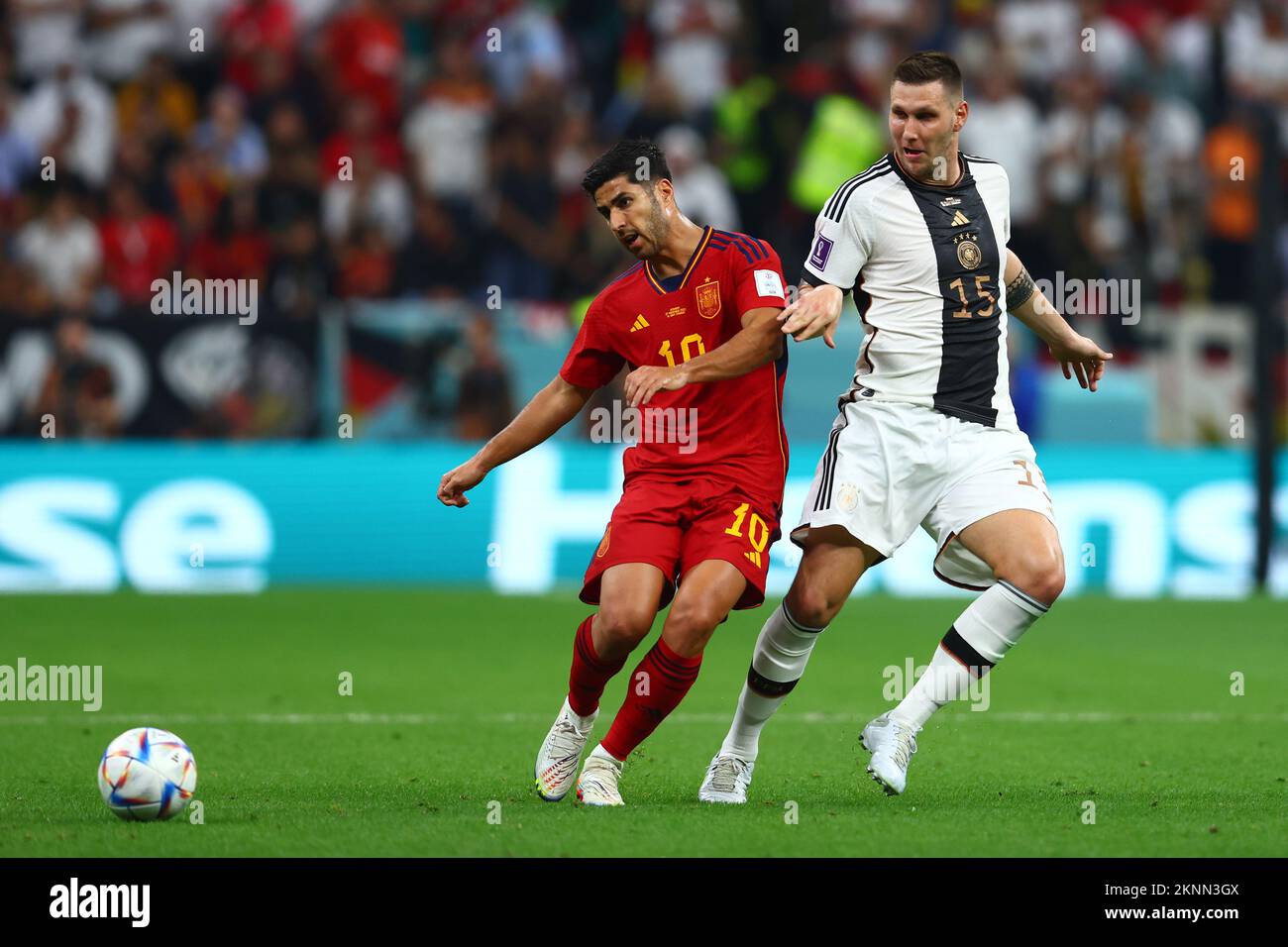 Doha, Qatar. 27th Nov, 2022. Marco Asensio (L) of Spain in action with ...