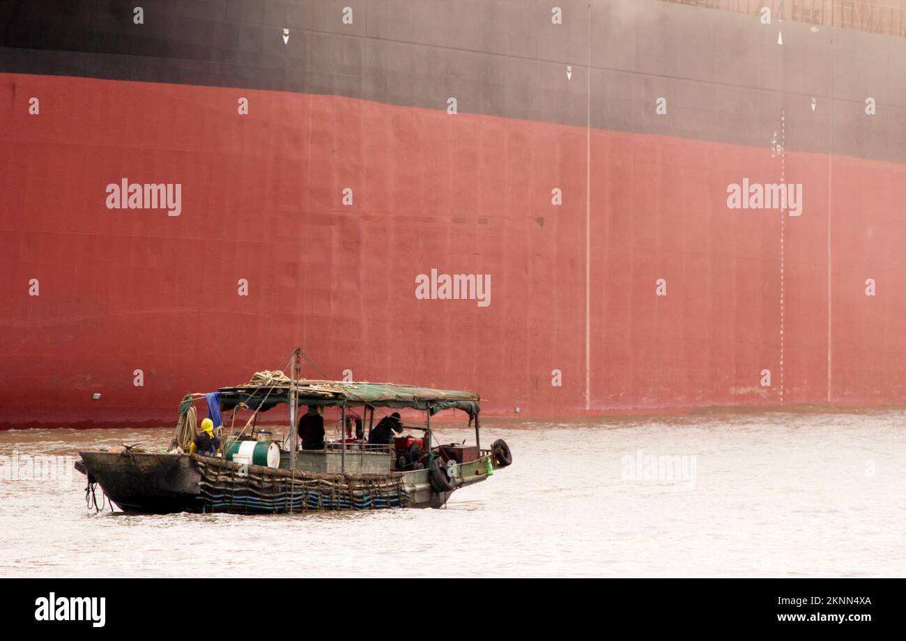 A traditional vessel and a newly constructed ships, Huangpu river ...