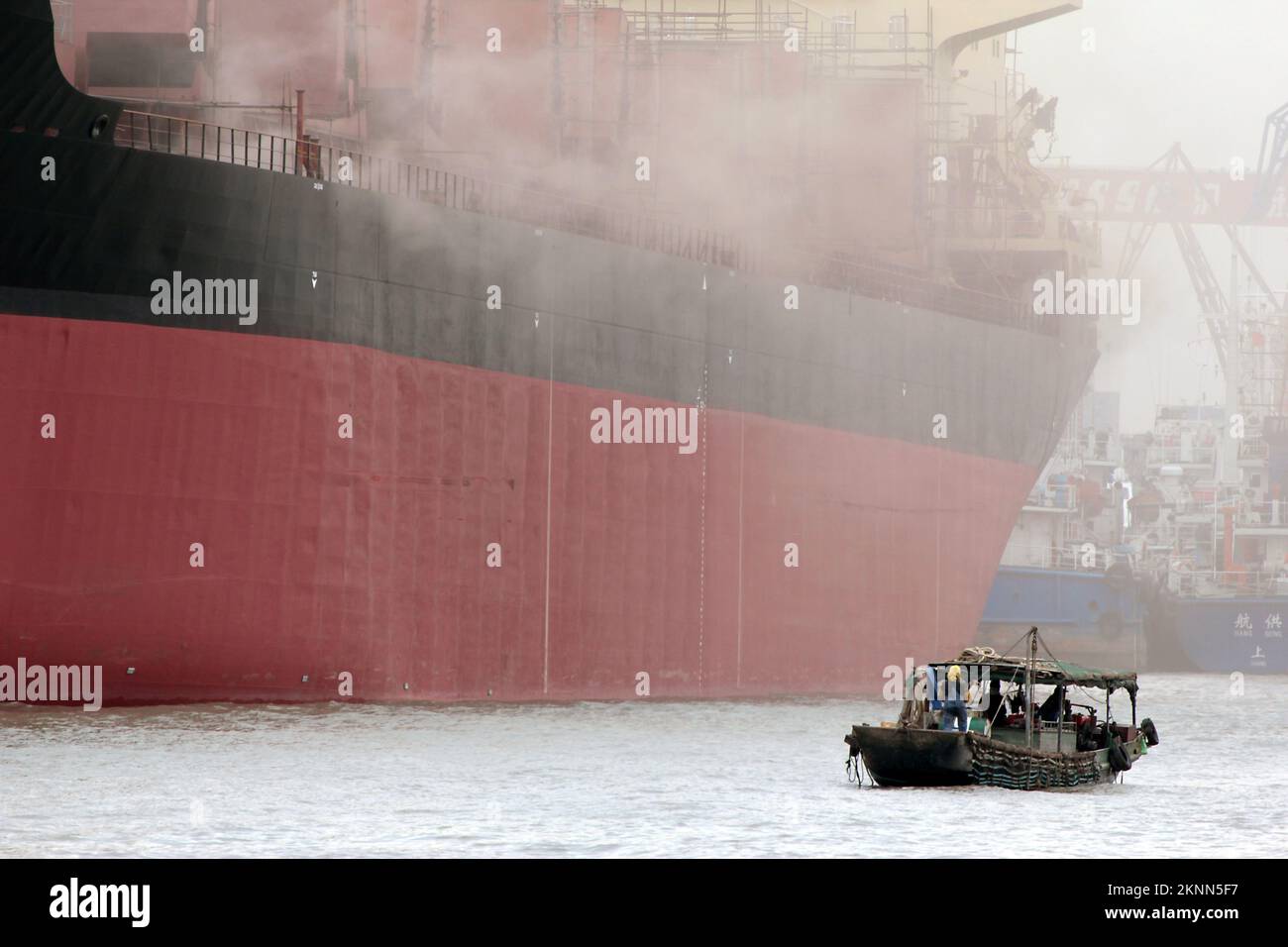 A traditional vessel and a newly constructed ships, Huangpu river ...