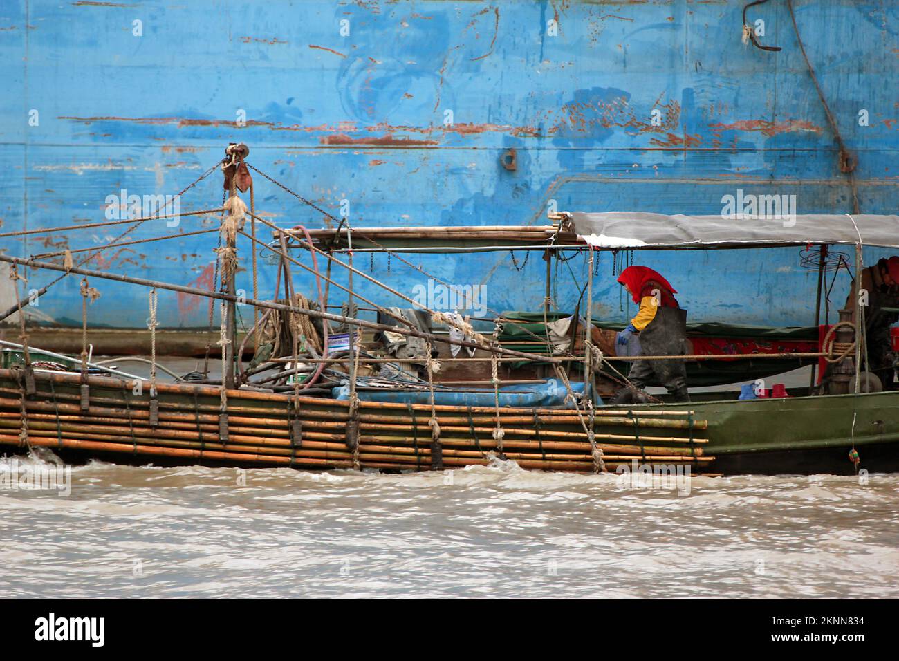 A traditional vessel and a newly constructed ships, Huangpu river ...