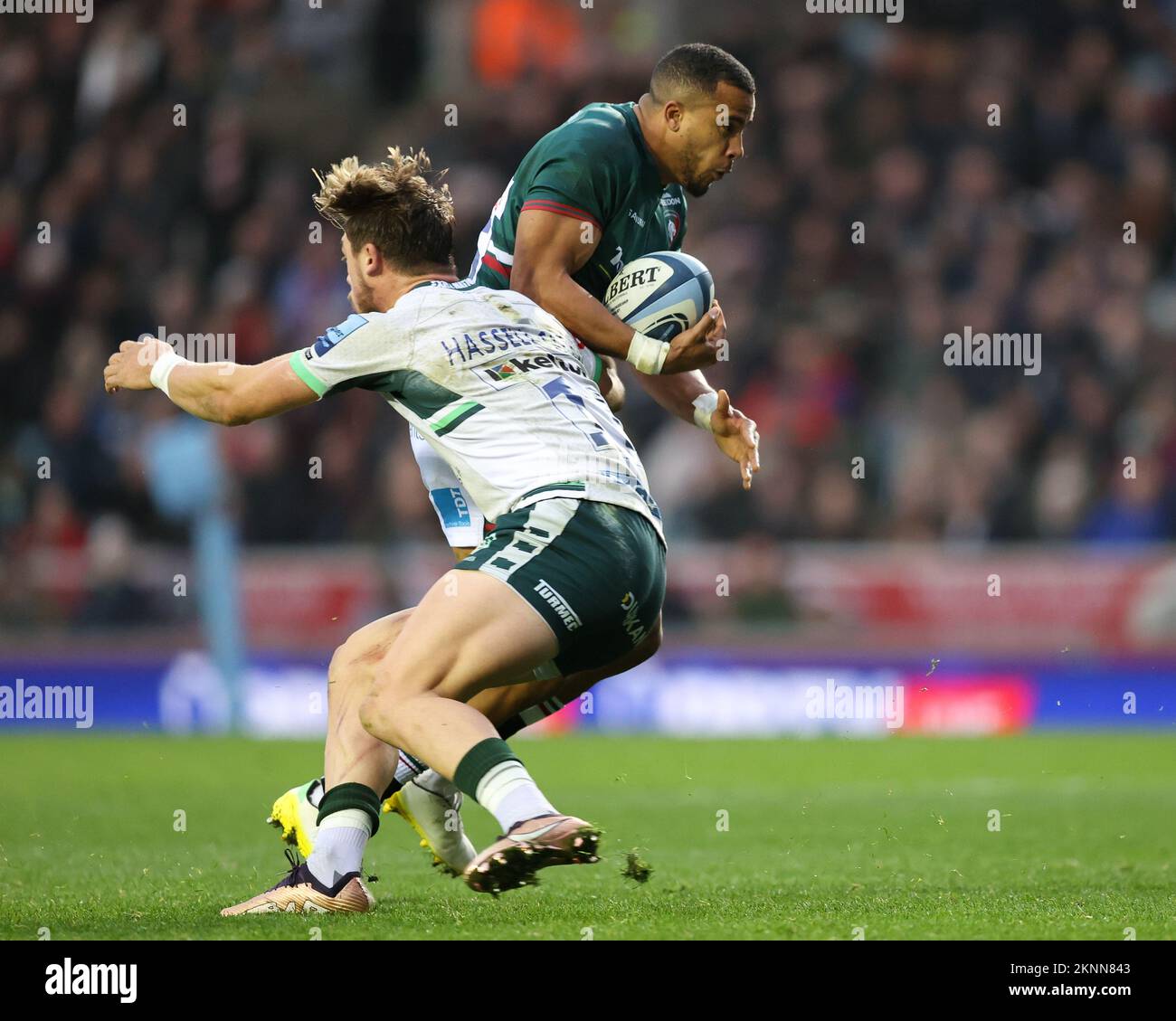 Anthony Watson of Leicester Tigers is tackled by Ollie Hassell-Collins ...