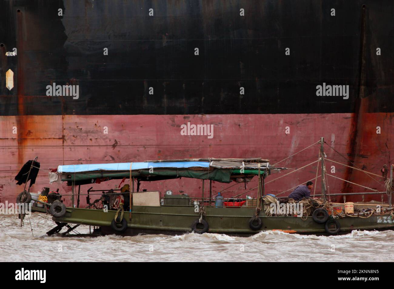 A traditional vessel and a newly constructed ships, Huangpu river ...