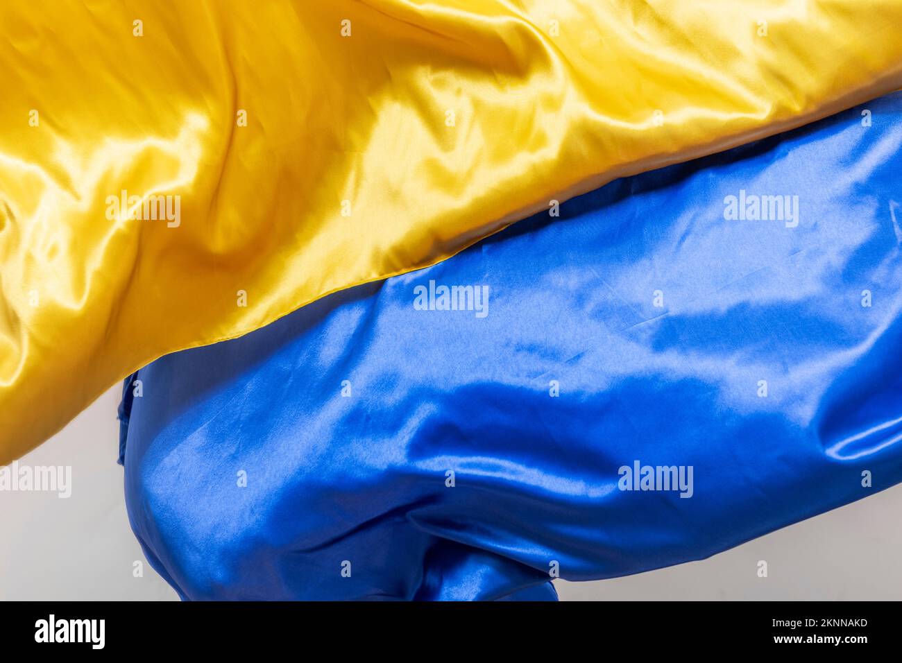 Two bright satin two-tone fabrics floating in the wind with the colors ...