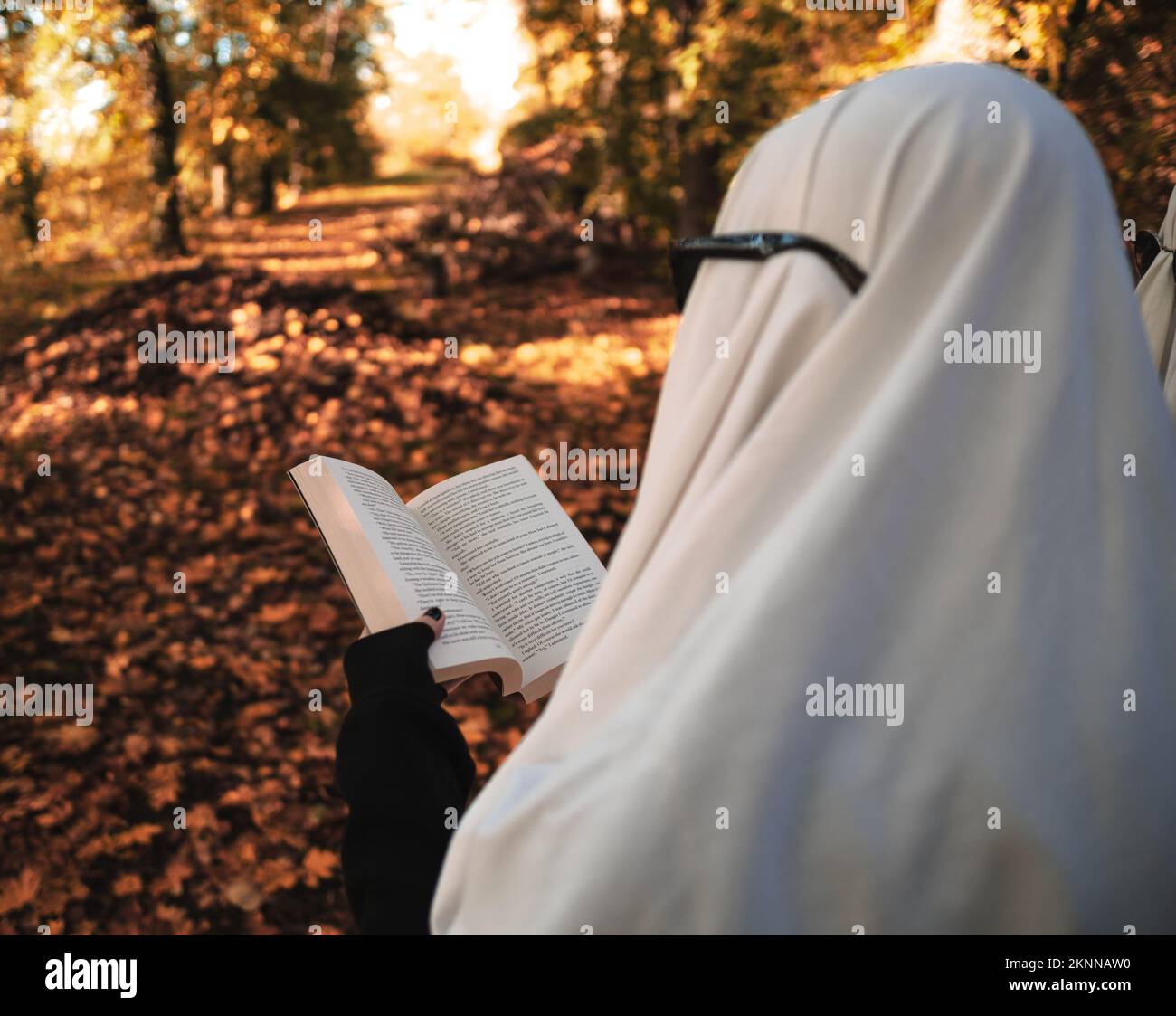 A funny image of two people in ghost costumes and sunglasses are ...