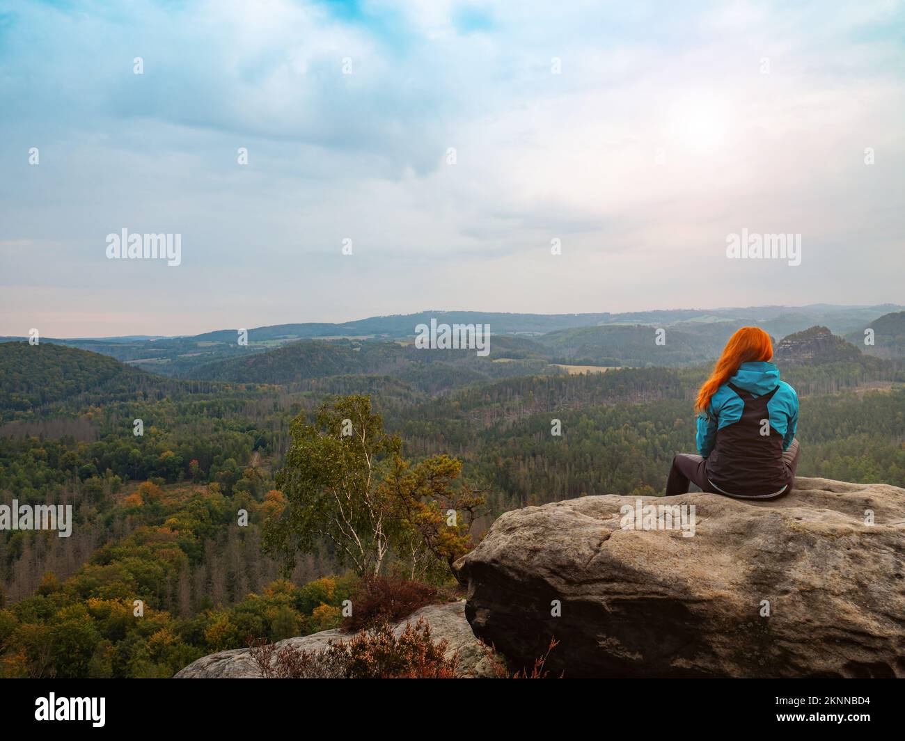 Sad man sitting on rocks hi-res stock photography and images - Alamy