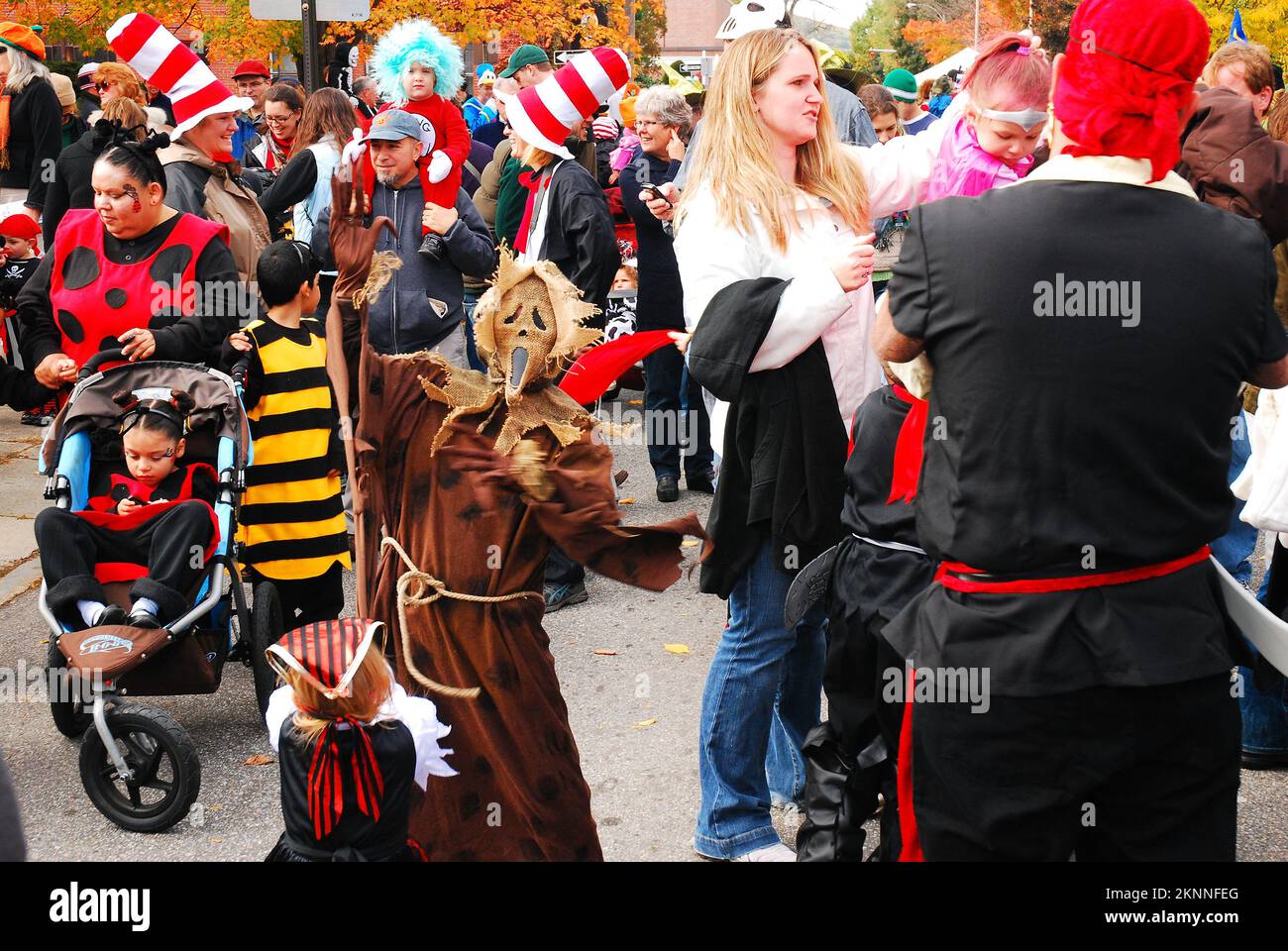 Families gather in costume, ready to head out for a Halloween Parade ...