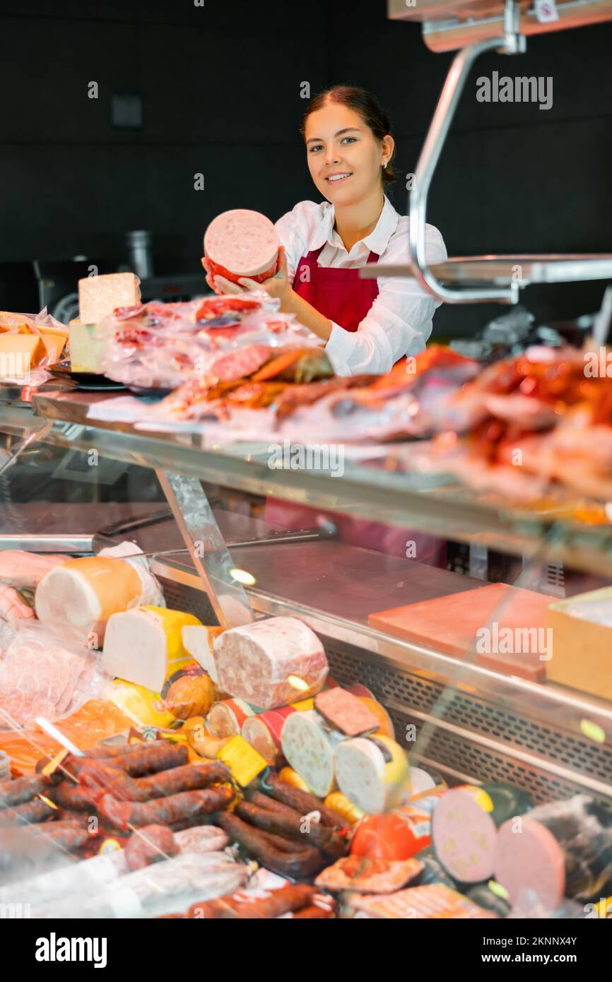 Young woman butchery worker at counter Stock Photo - Alamy