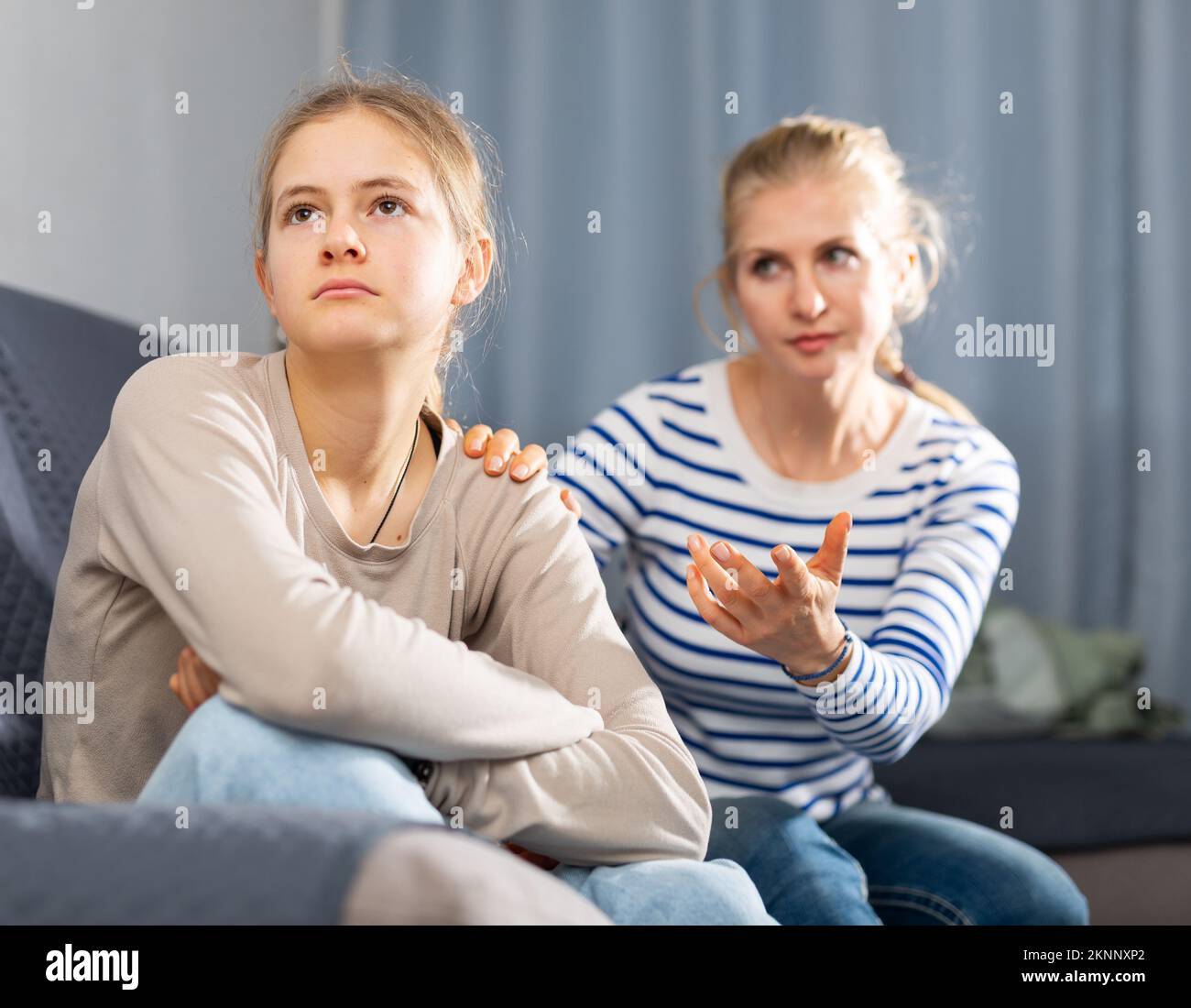 Sad teen girl after discord with her mother Stock Photo - Alamy