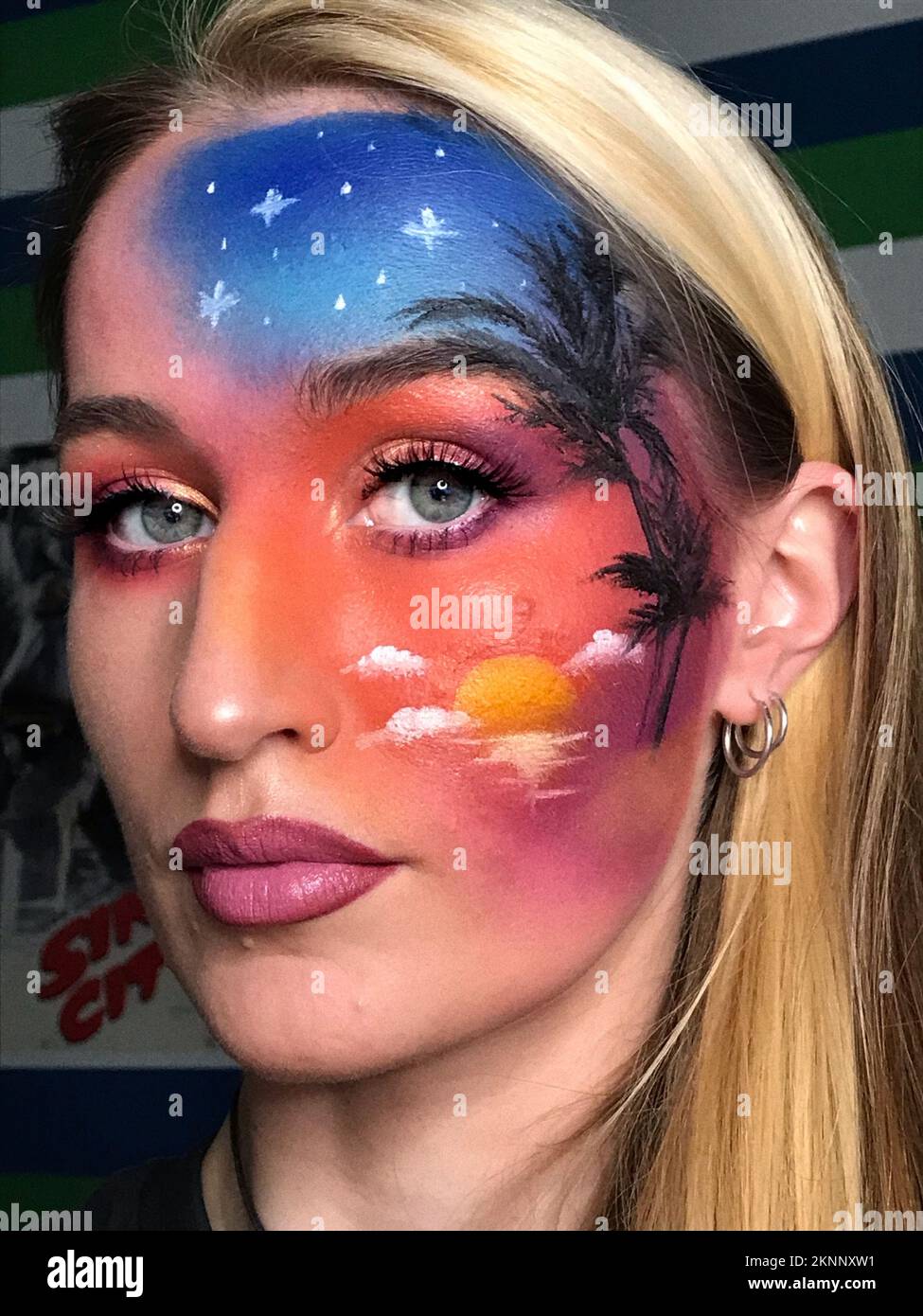 Gorgeous woman with island palms and sunset face art Stock Photo - Alamy