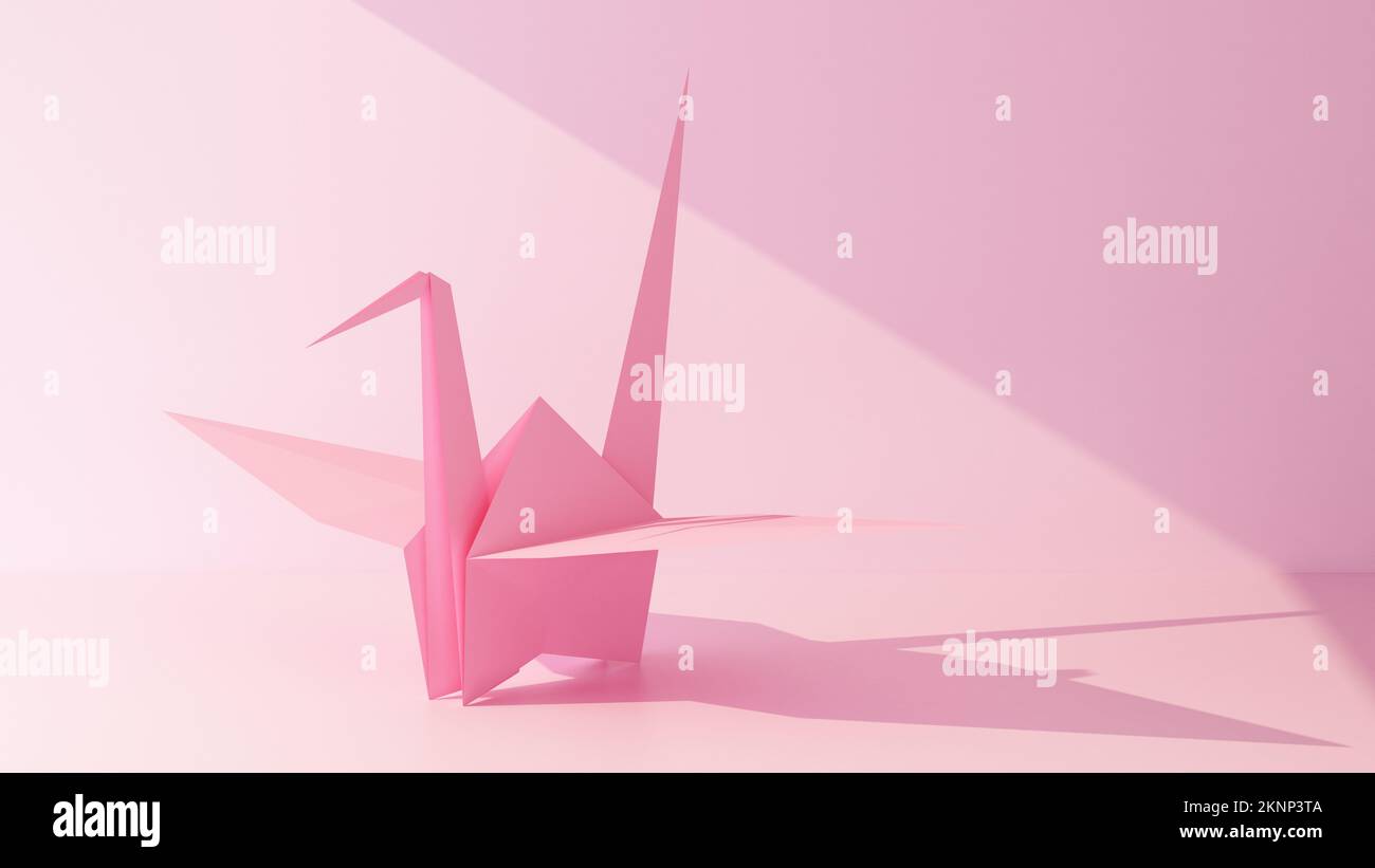 pink origami bird figurine illuminated by a beam of light on a pink ...