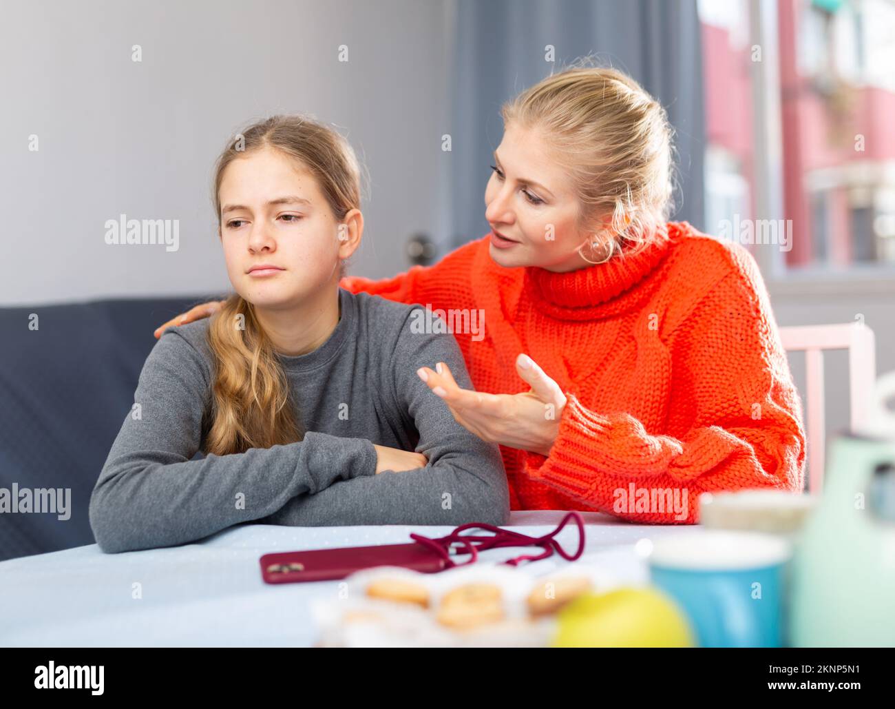 Sad teen girl after discord with her mother Stock Photo - Alamy