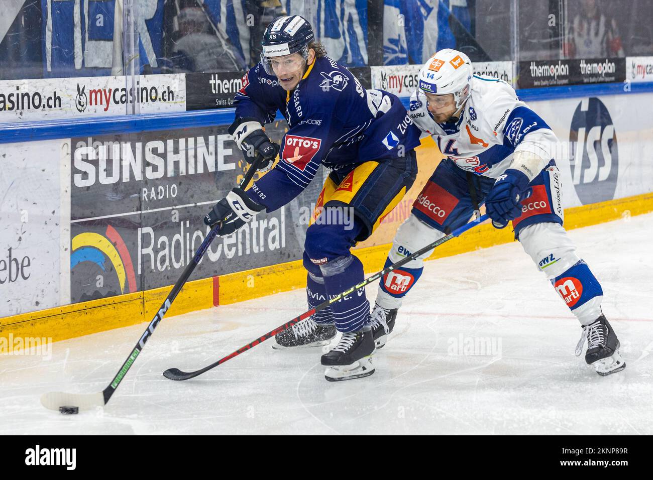 Chris Baltisberger #14 (ZSC Lions) against Sven Senteler #88 (EV Zug ...