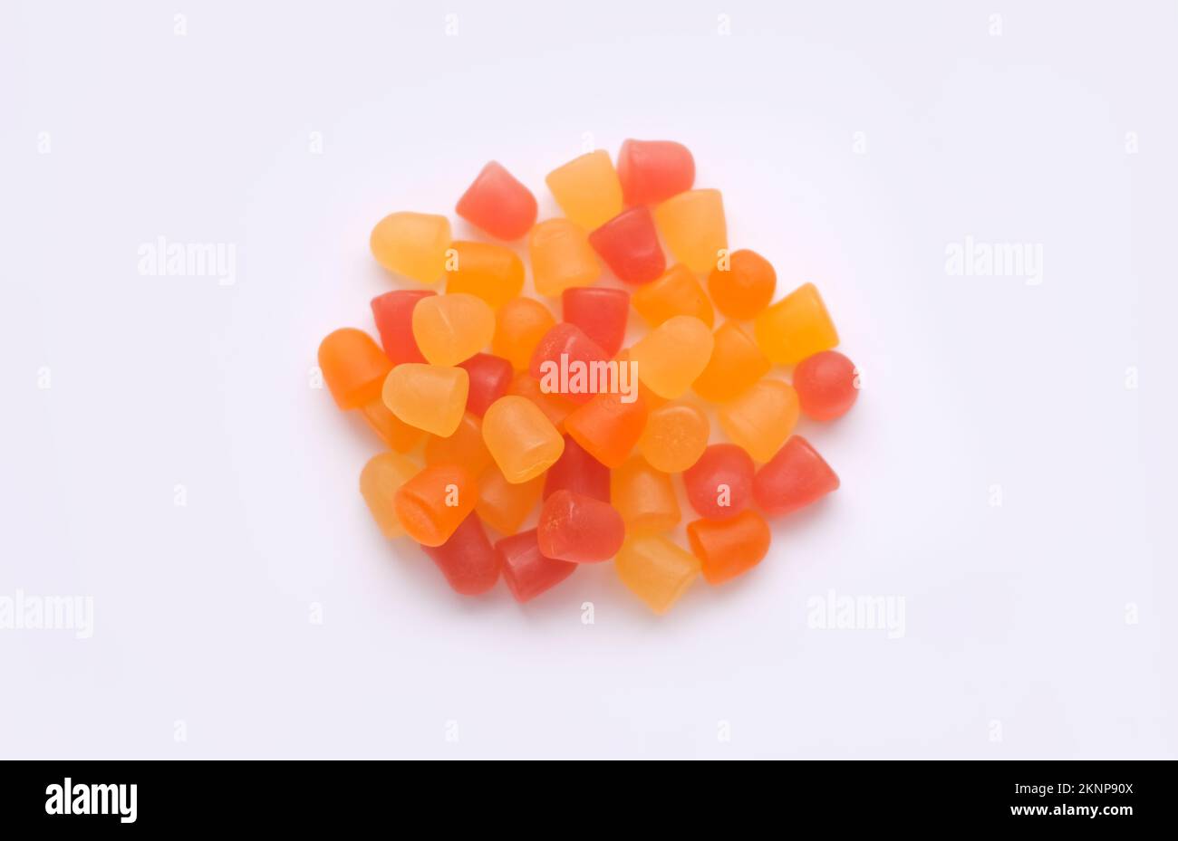 Selective focus, close-up texture of orange and yellow multivitamin ...