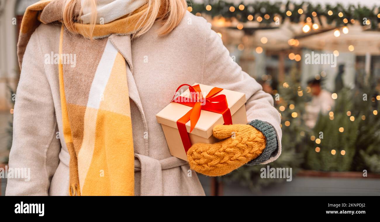 Closeup of hands give surprise gift box, gift brown package box with ...