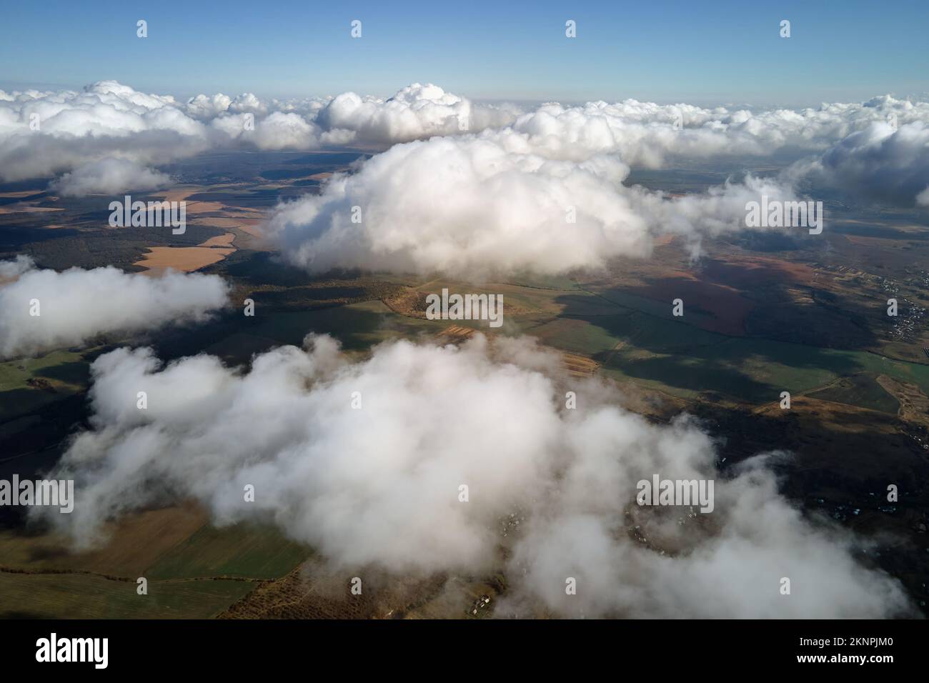 Aerial view from airplane window at high altitude of earth covered with ...
