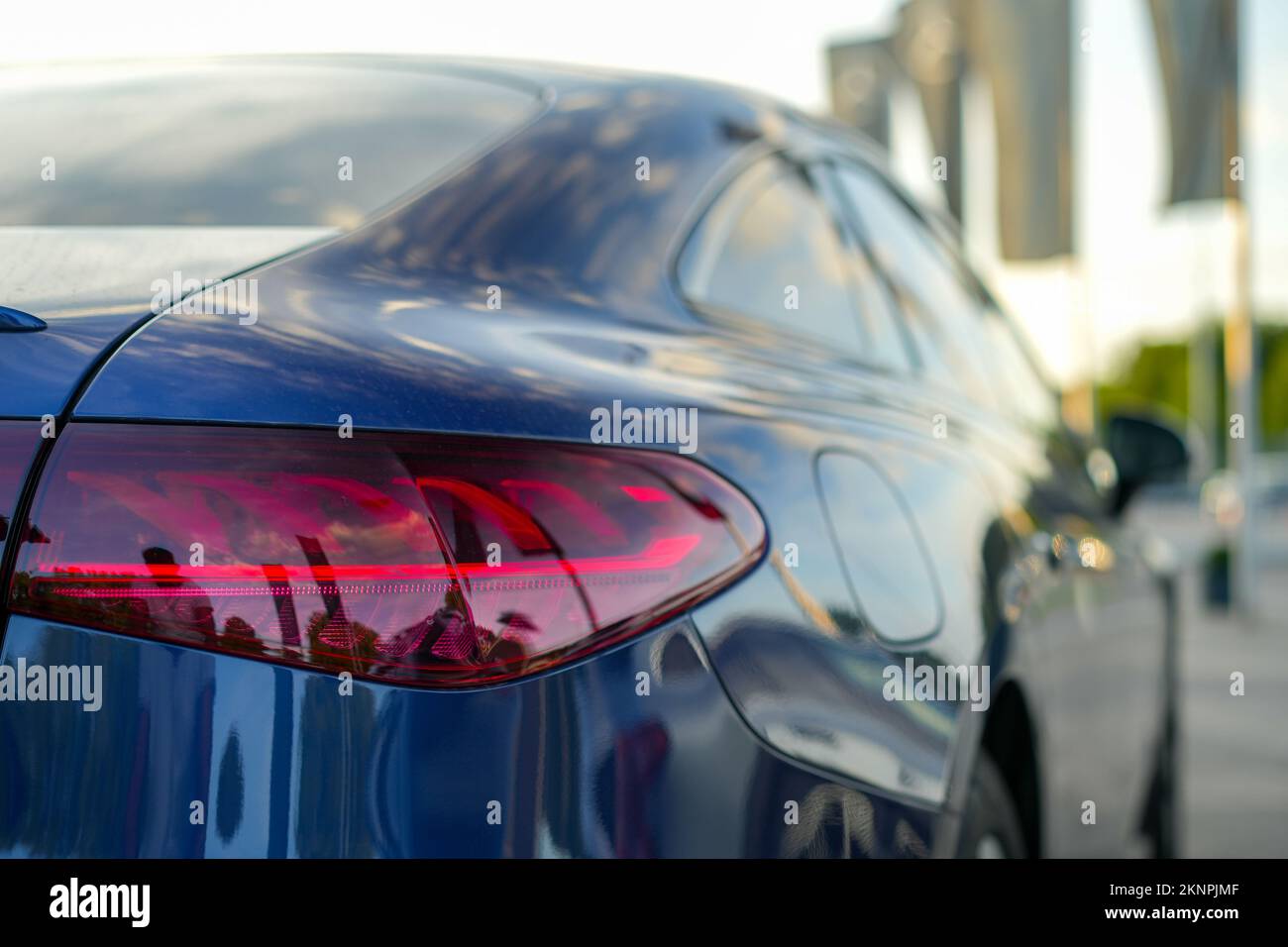 A closeup of a front beam headlight of a navy car Stock Photo - Alamy