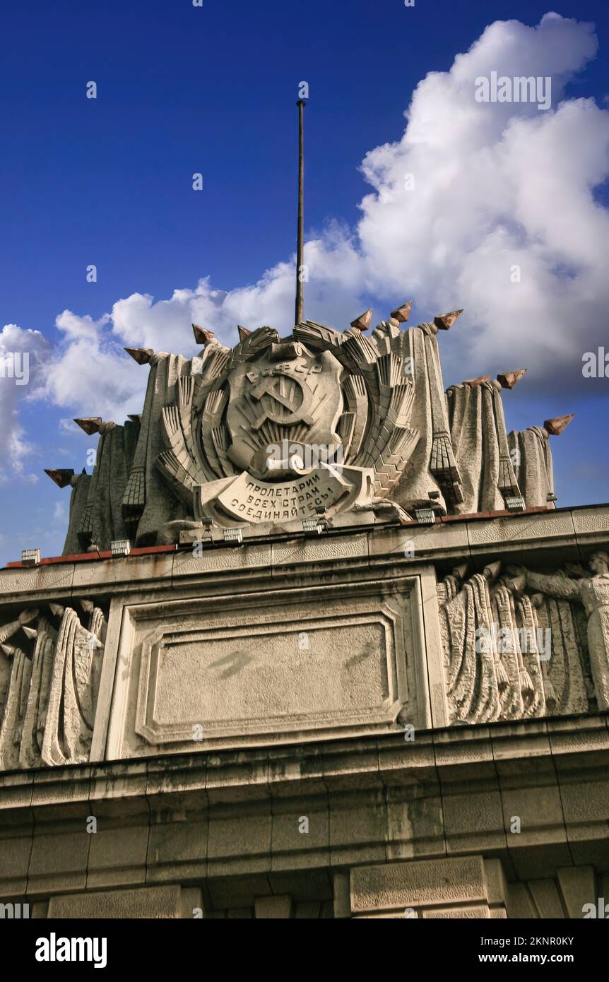 The Hammer and Sickle symbols of the Soviet era, carved on a palace in ...