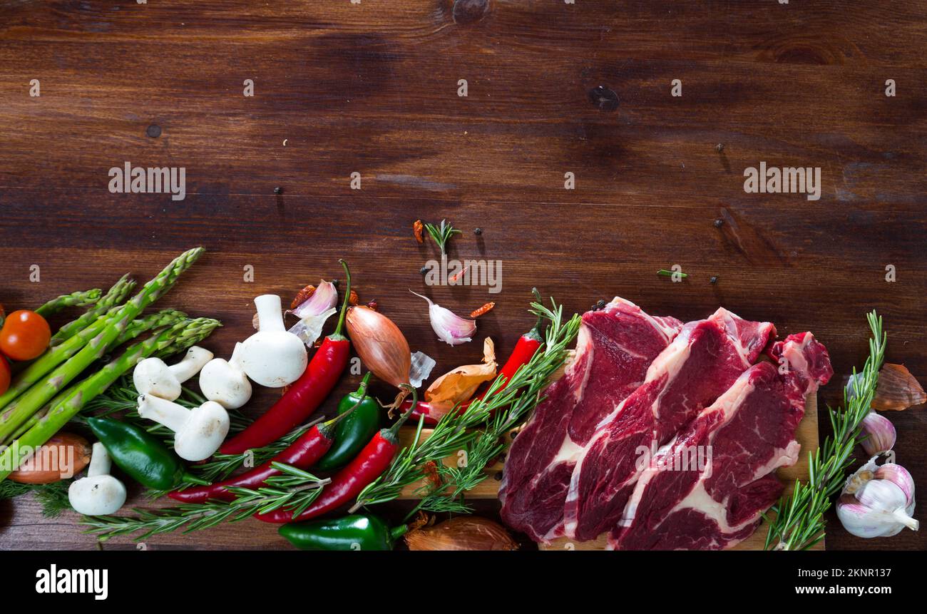 Natural background with raw beef, vegetables Stock Photo - Alamy