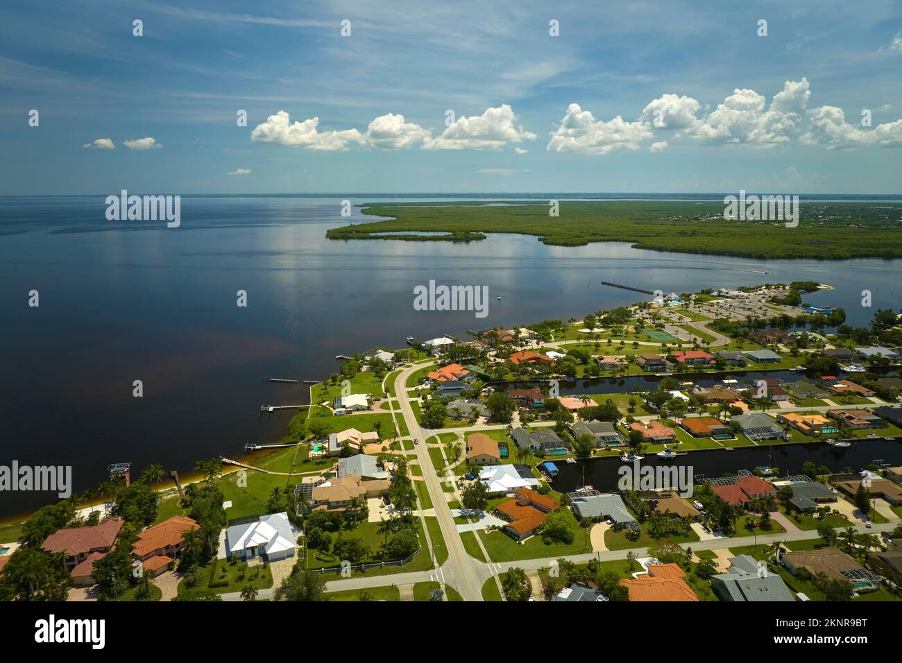 Aerial view of rural private houses in remote suburbs located on sea ...