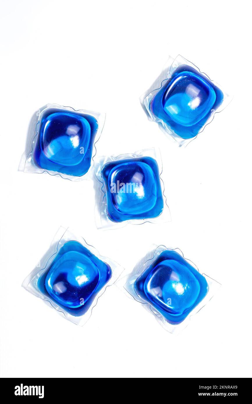 Capsules with detergent for washing machine isolated on white ...