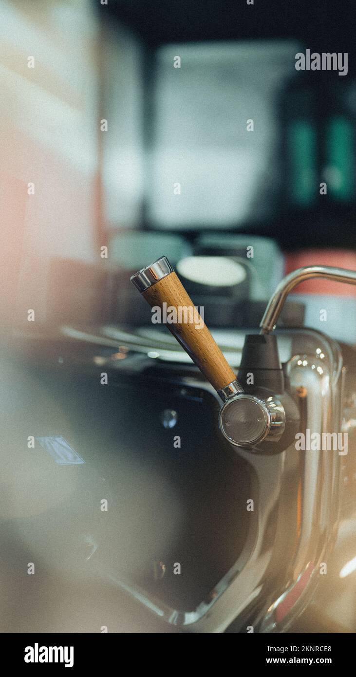 A vertical shot of a coffee machine lever Stock Photo - Alamy