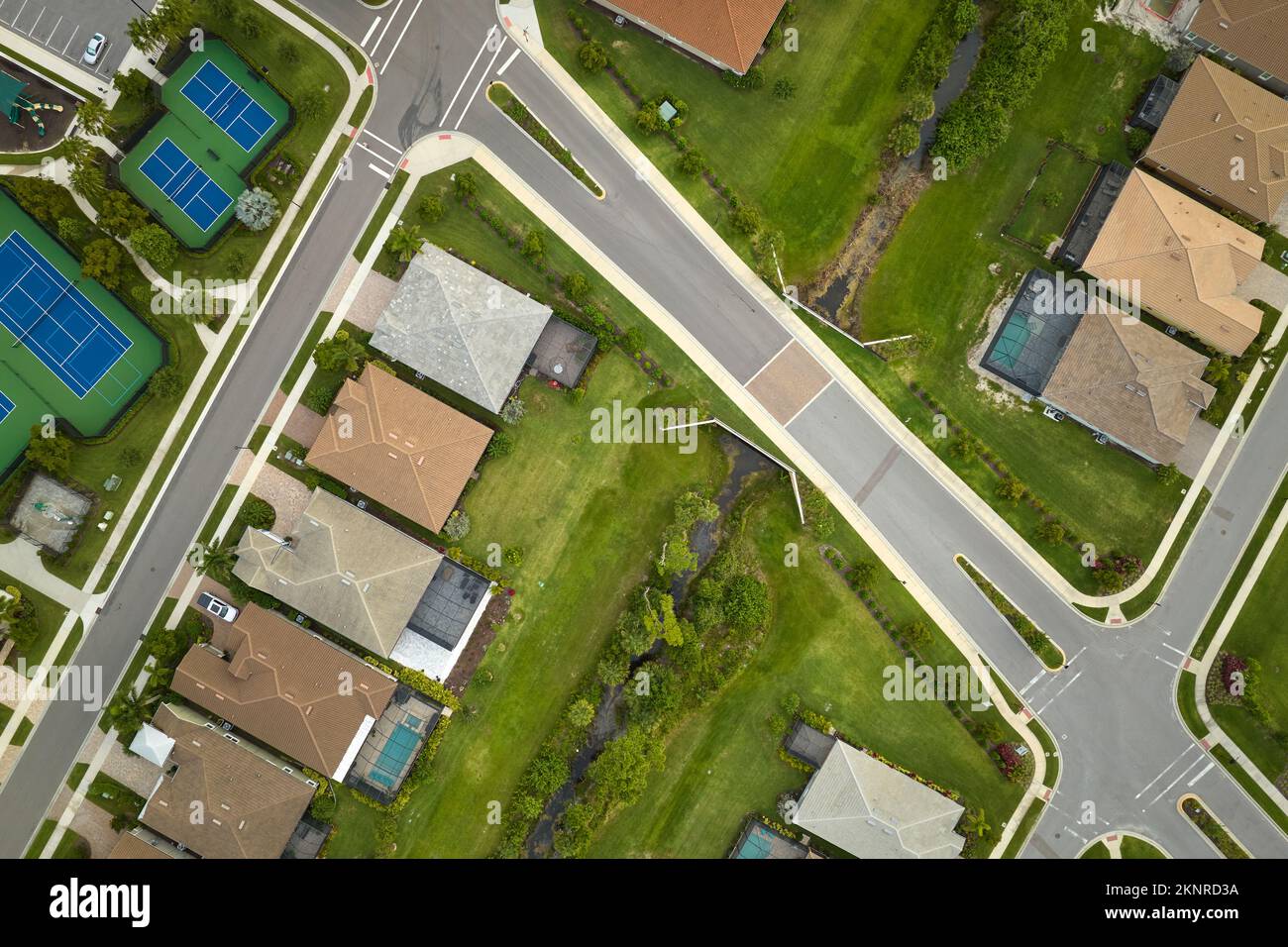 Aerial view of tightly located family houses in Florida closed suburban ...