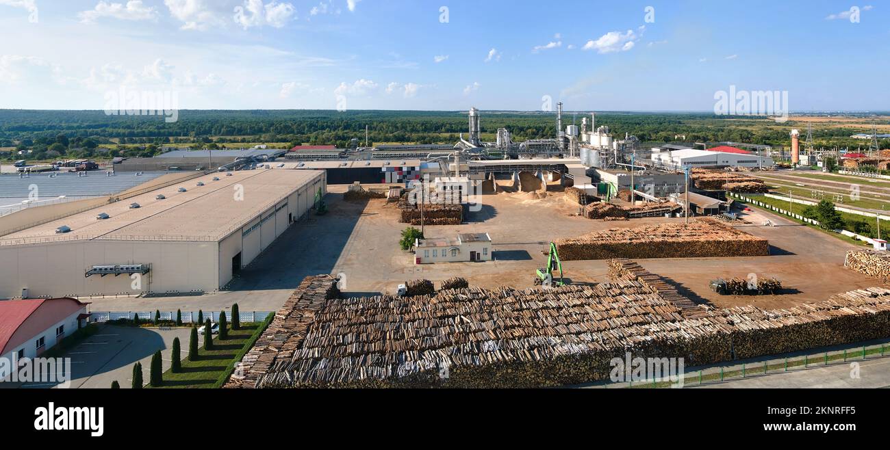 Aerial view of wood processing factory with stacks of lumber at plant ...