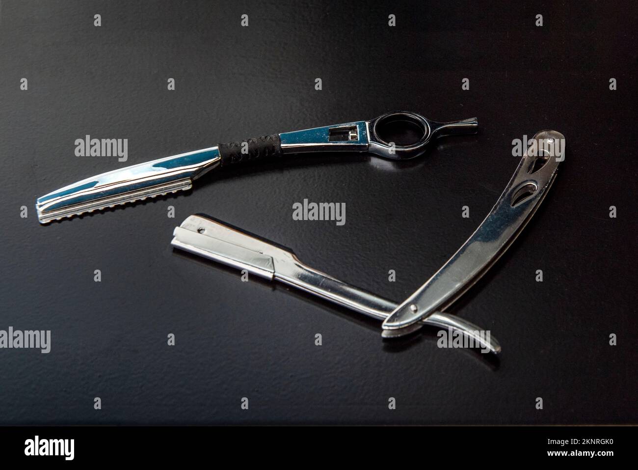 Men's barber tools with a hair remover and a folding blade Stock Photo ...