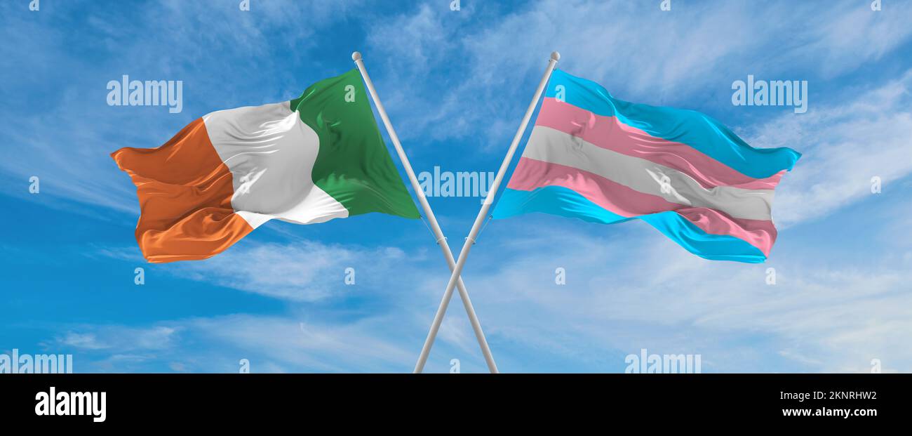 two crossed flags transgender Pride and Ireland waving in wind at ...