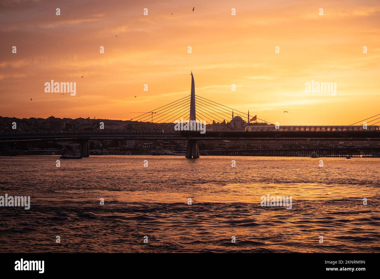 A beautiful view of Istanbul harbor at sunset during summer Stock Photo ...