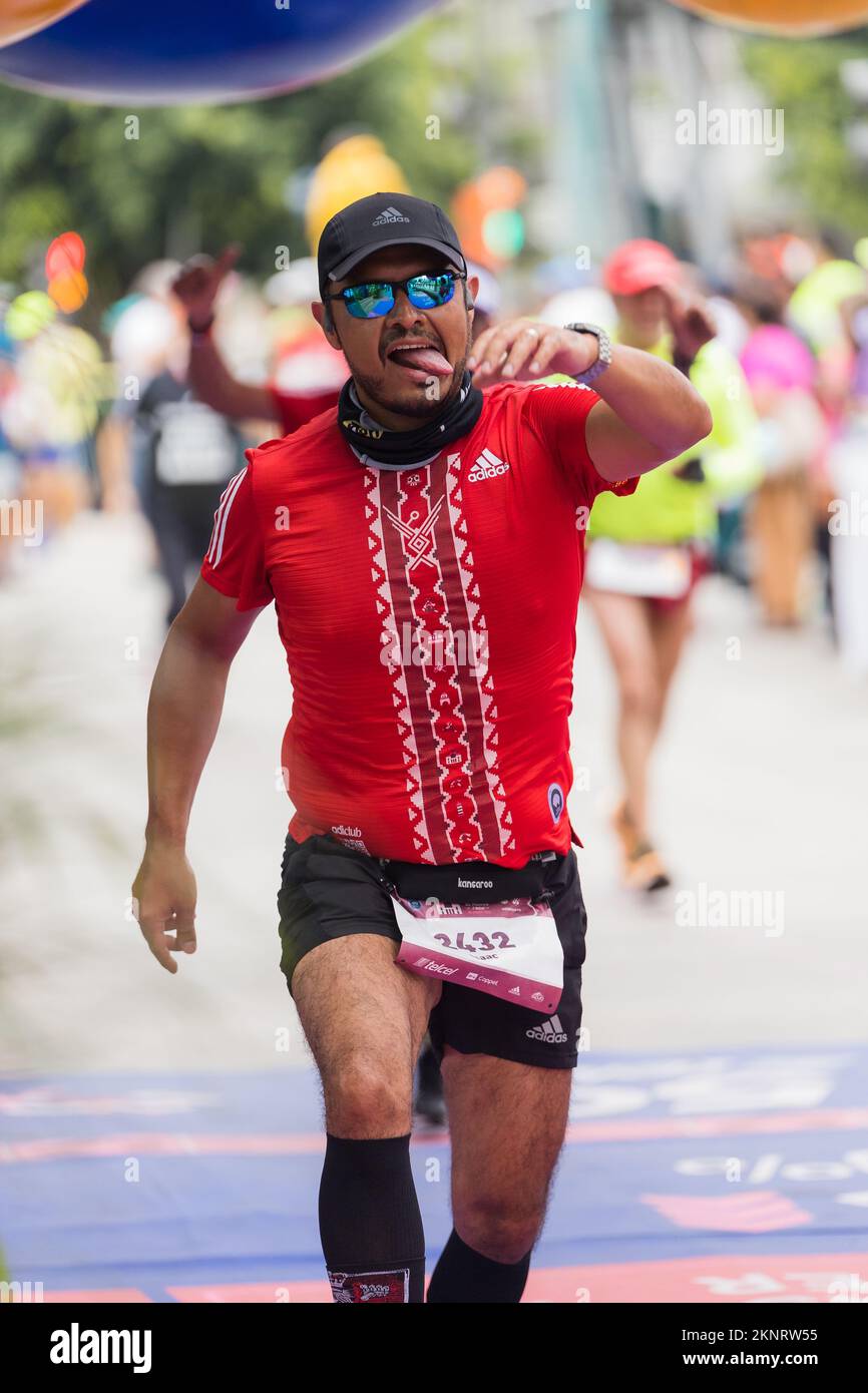 A man running the International Marathon of Mexico city on the street ...